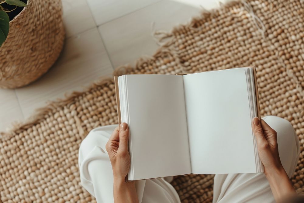 Reading blank book on rug | Free Photo - rawpixel