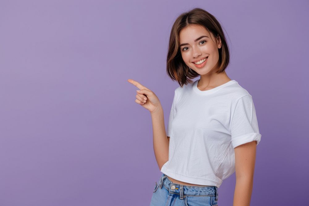 Smiling woman pointing left | Free Photo - rawpixel