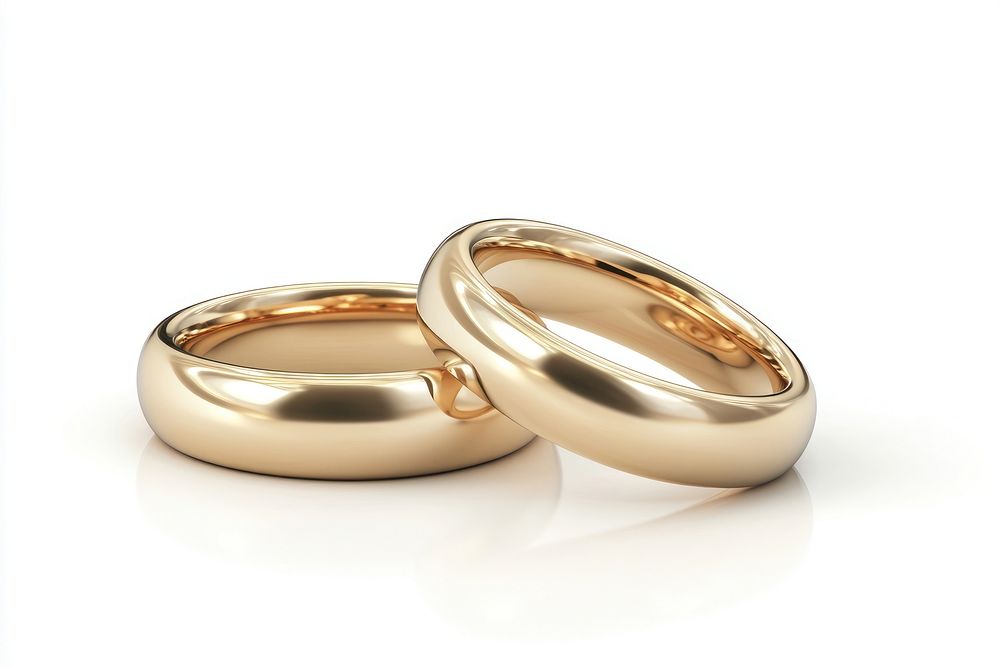 Elegant gold wedding rings pair | Free Photo - rawpixel