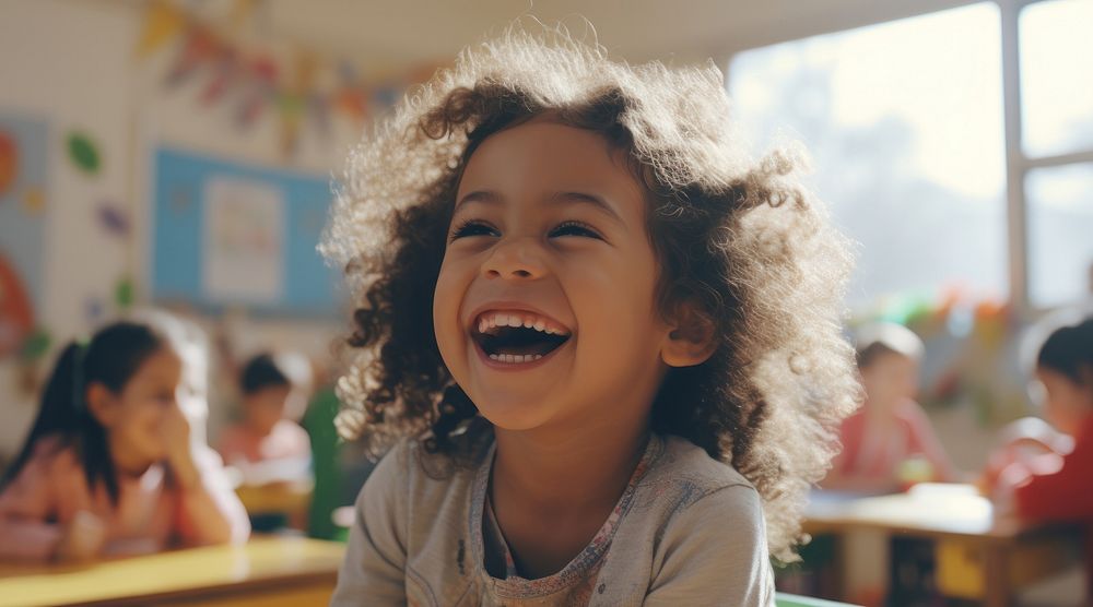 Joyful child in classroom setting | Free Photo - rawpixel