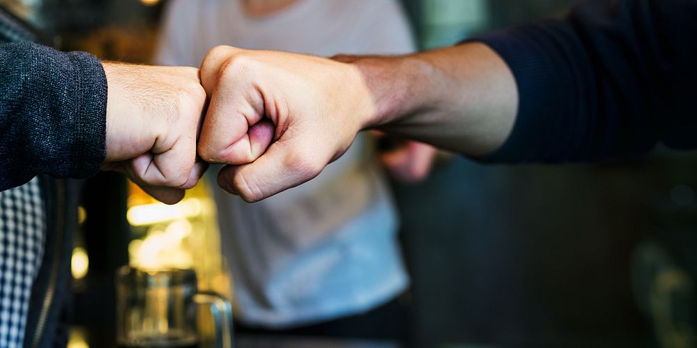 Fist bumping hands together unity | Free Photo - rawpixel