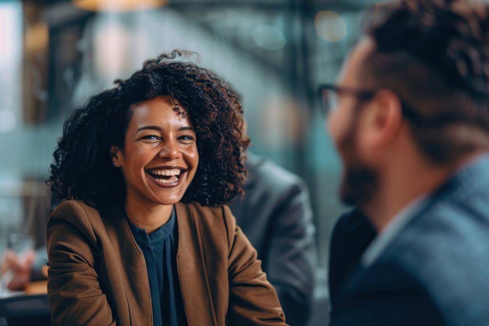 Happy professionals engaging in conversation | Free Photo - rawpixel