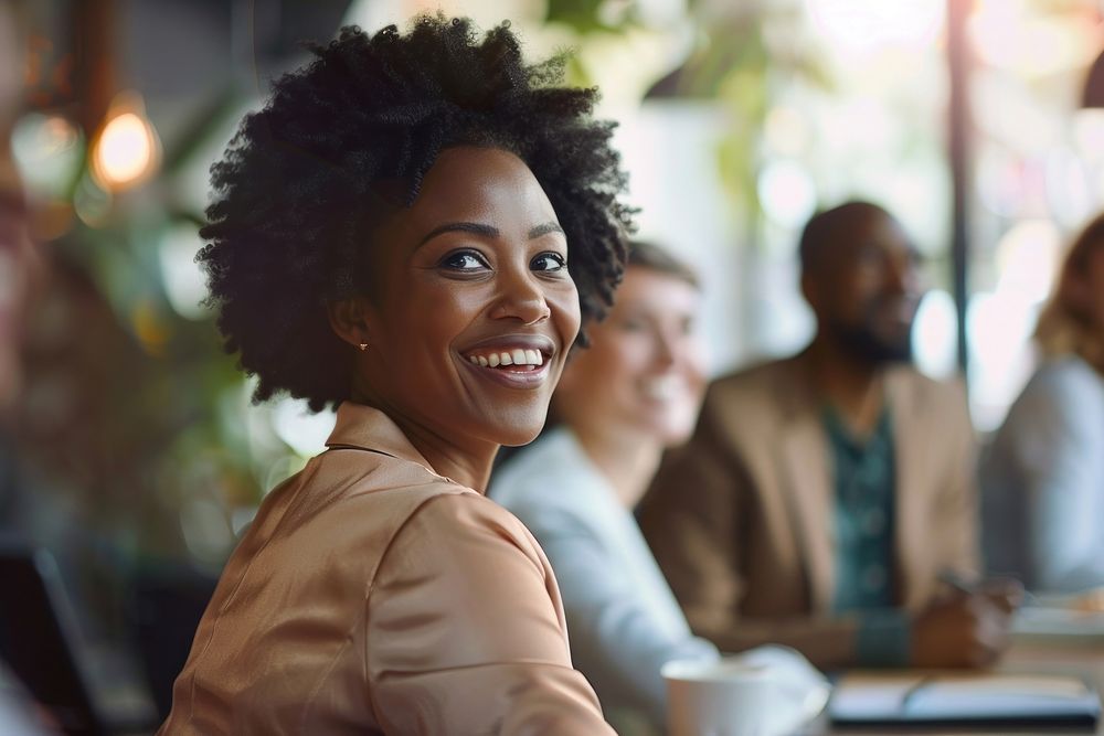 Smiling woman in professional setting | Free Photo - rawpixel