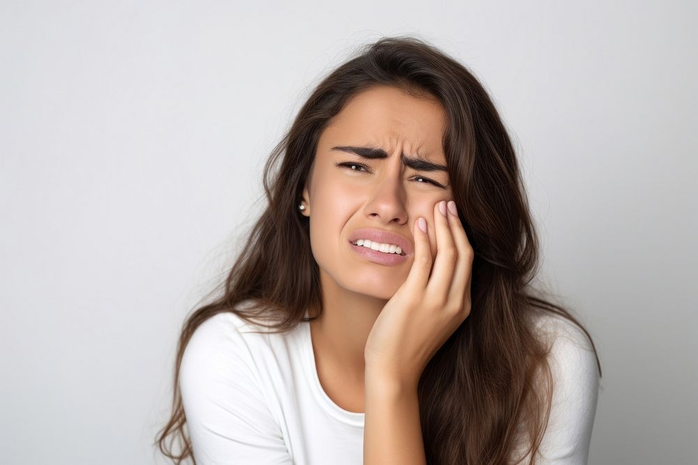 Woman experiencing severe toothache pain. | Free Photo - rawpixel