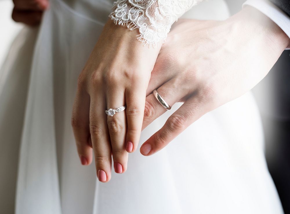 Elegant wedding rings on hands | Free Photo - rawpixel