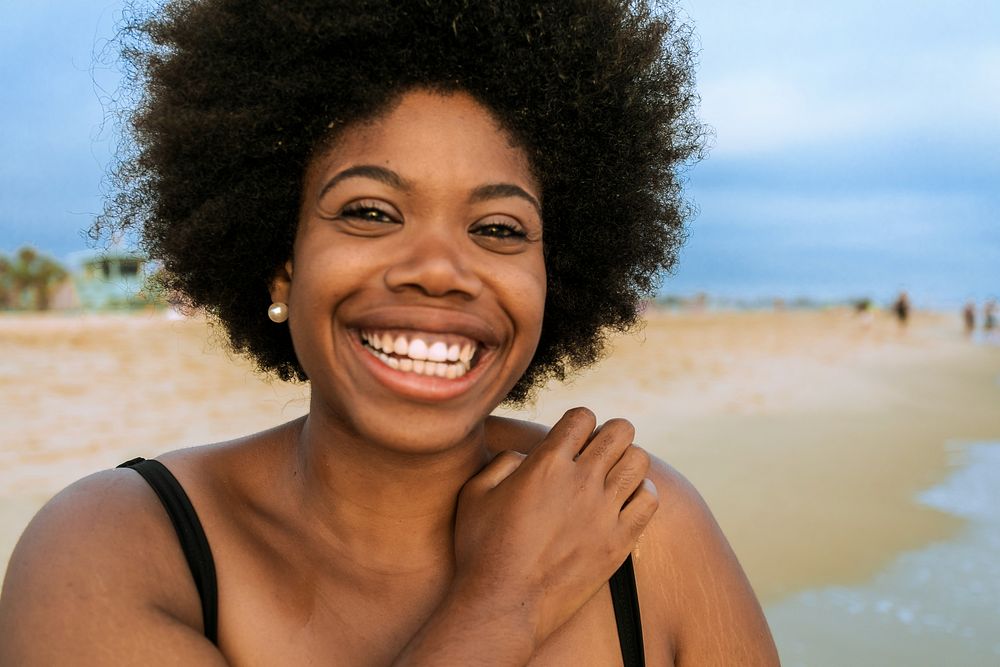 Smiling African American woman beach. | Premium Photo - rawpixel