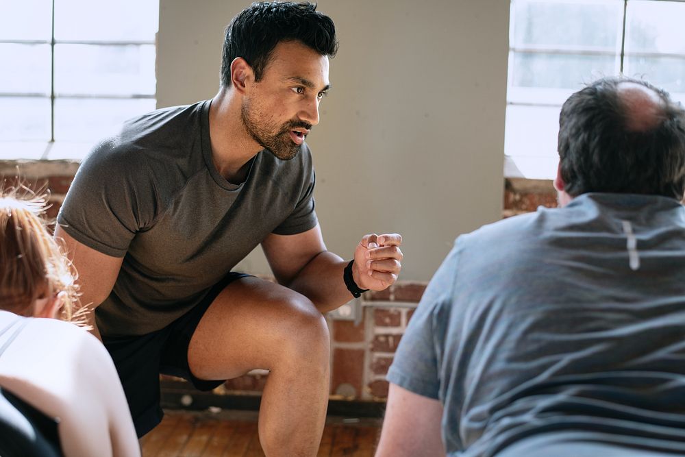 Male fitness trainer, instructing group | Premium Photo - rawpixel