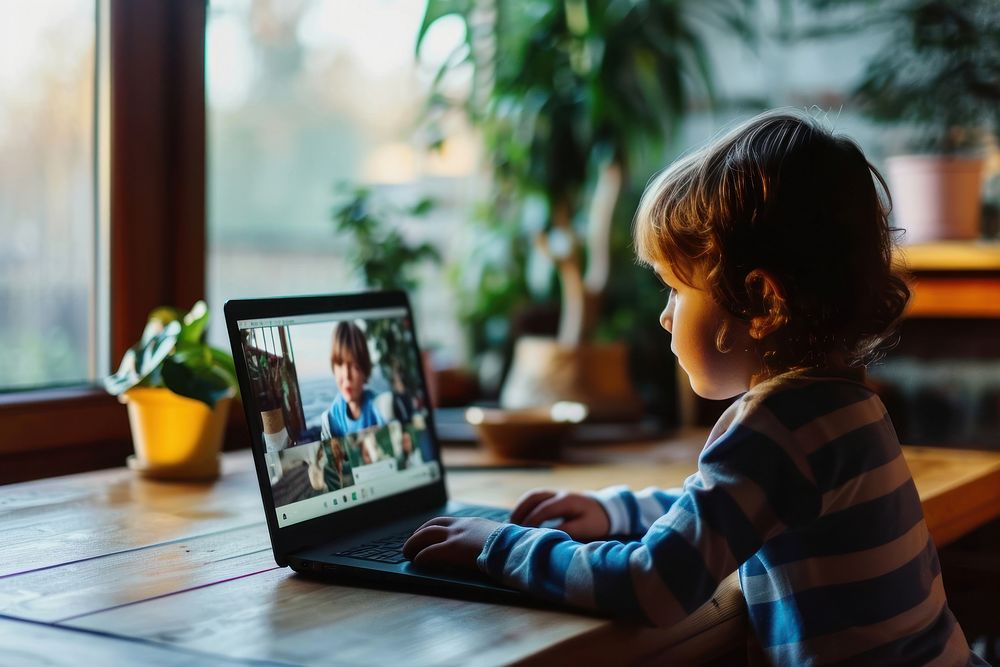 Child having video call laptop | Premium Photo - rawpixel