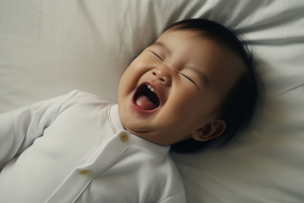 East Asian baby laughing yawning | Premium Photo - rawpixel