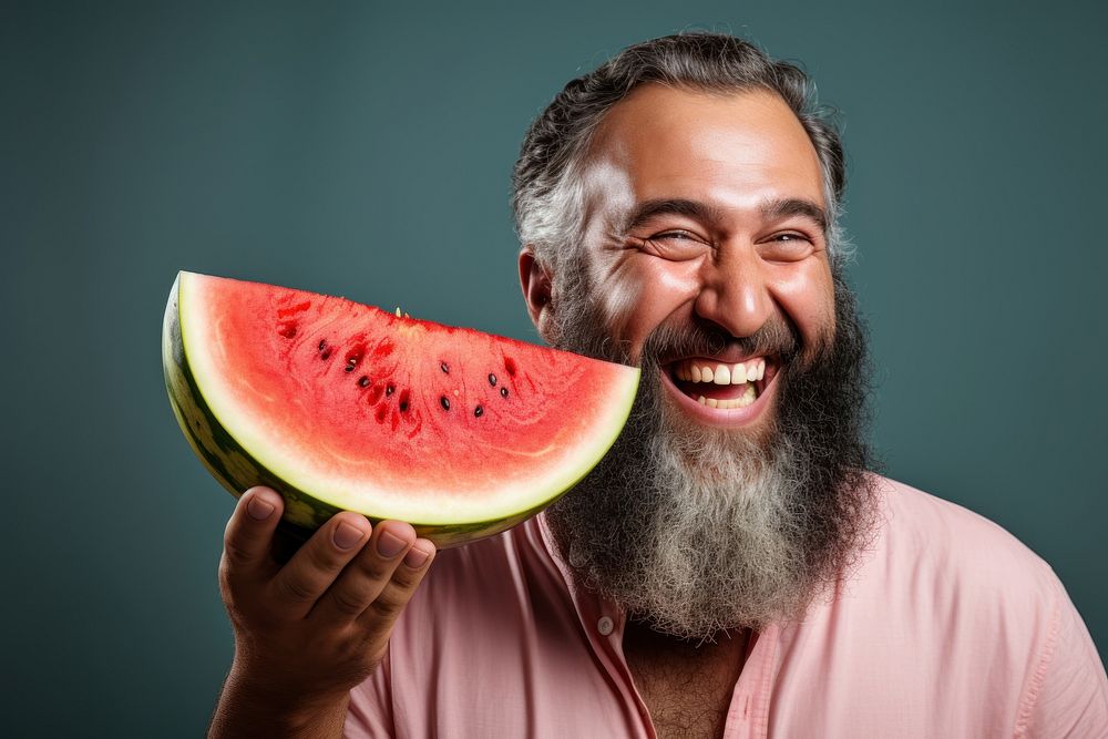 Middle eastern man eating watermelon | Free Photo - rawpixel
