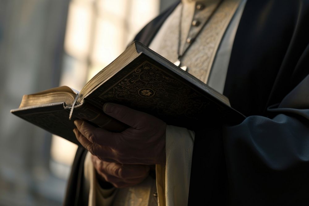 Priest holding bible publication adult | Free Photo - rawpixel