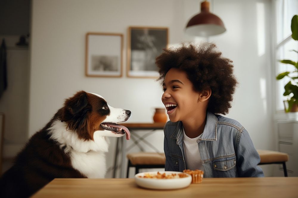 Boy giving treat dog mammal | Free Photo - rawpixel