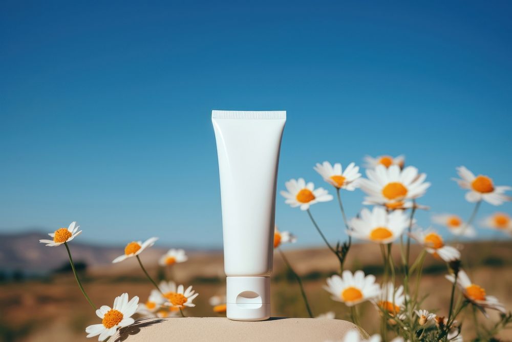 Sunscreen tube flower plant sky. | Premium Photo - rawpixel