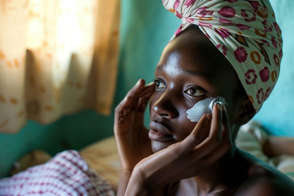 Kenyan woman applying adult skin. | Premium Photo - rawpixel