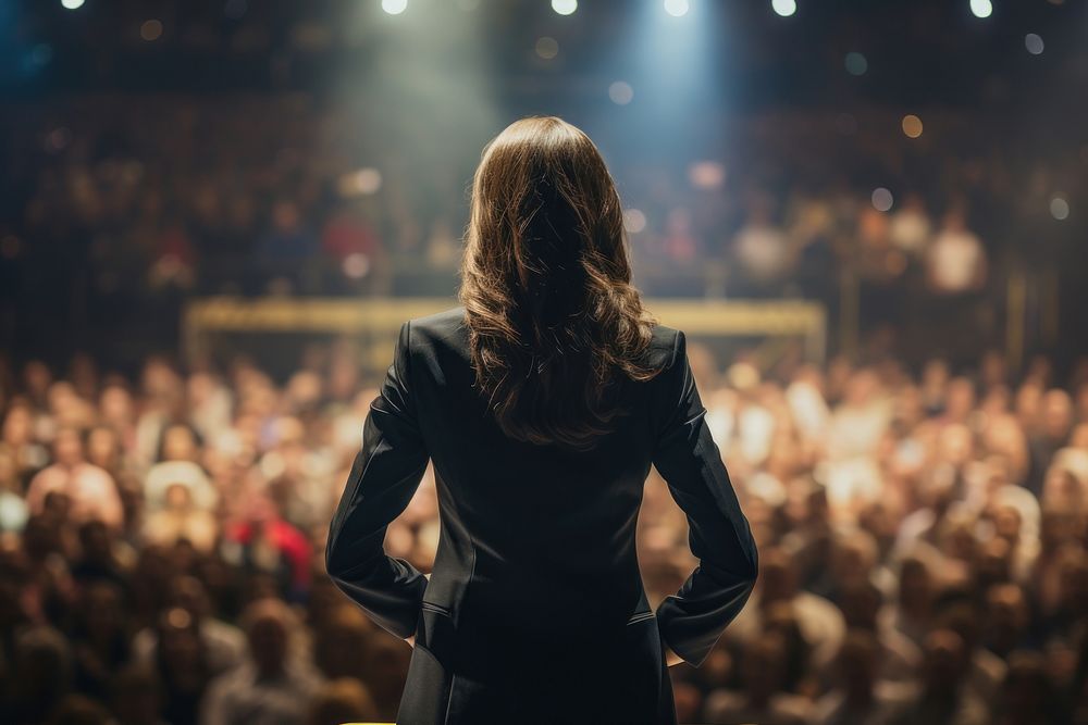 Back view motivational female speaker | Premium Photo - rawpixel