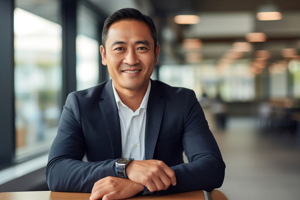 Filipino looking sitting office. | Free Photo - rawpixel