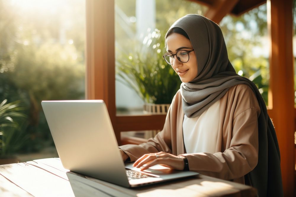 Muslim woman laptop computer typing. | Free Photo - rawpixel