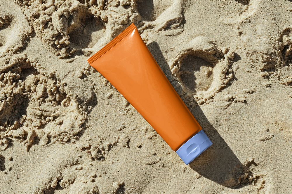 Orange sunscreen tube beach | Premium Photo - rawpixel