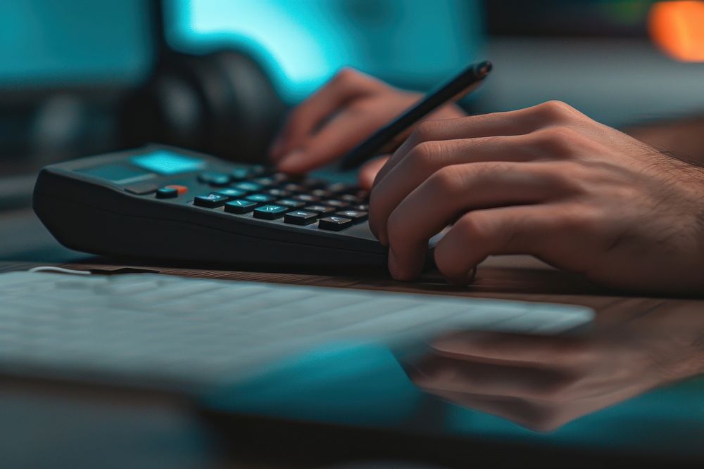 Hand holding calculator computer electronics | Free Photo - rawpixel