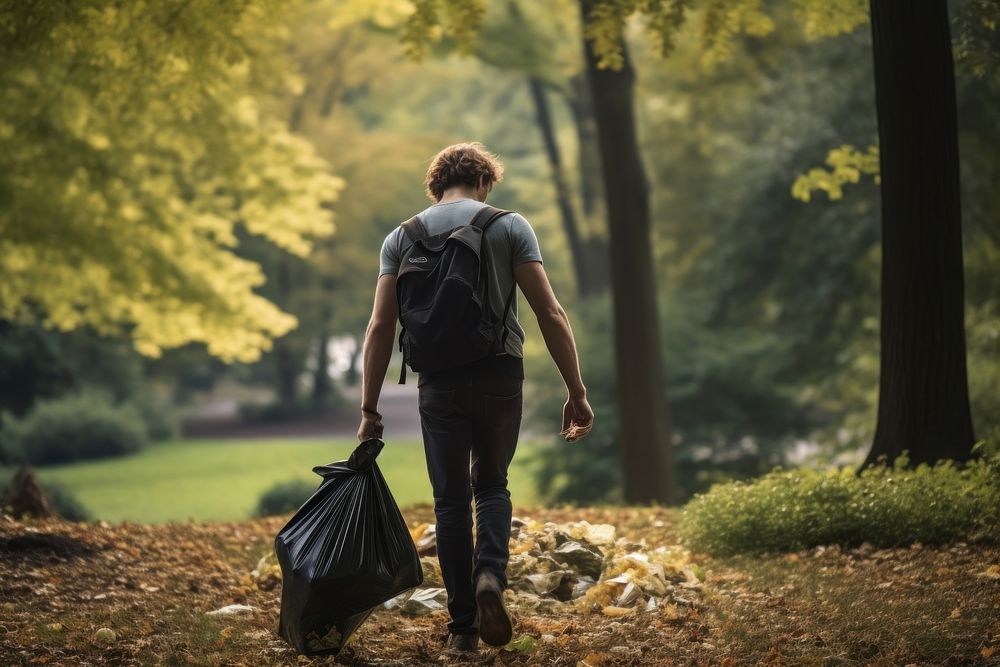 Environmental activist picking garbage backpack | Premium Photo - rawpixel
