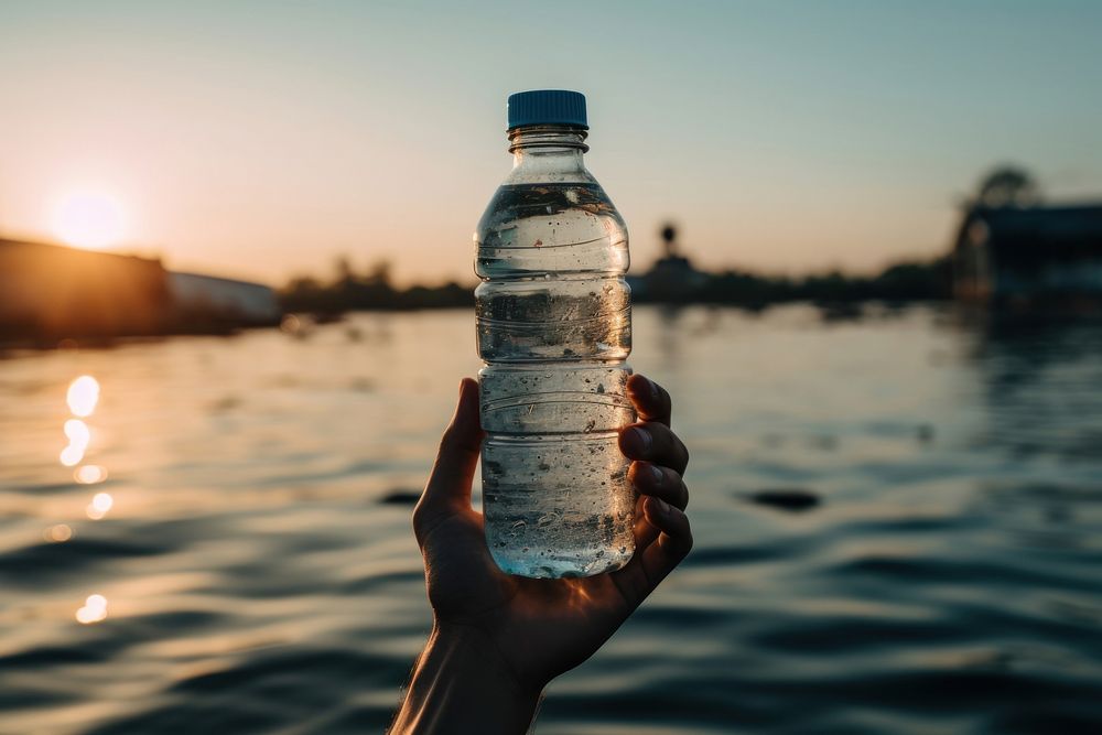 Holding bottle water bottle ammunition. | Free Photo - rawpixel