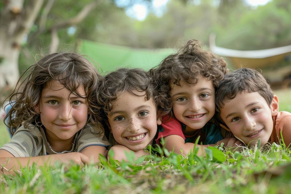 Middle eastern cheerful kids grass | Free Photo - rawpixel