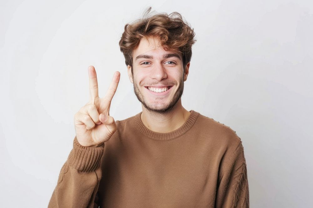 Person making peace sign cheerful | Free Photo - rawpixel