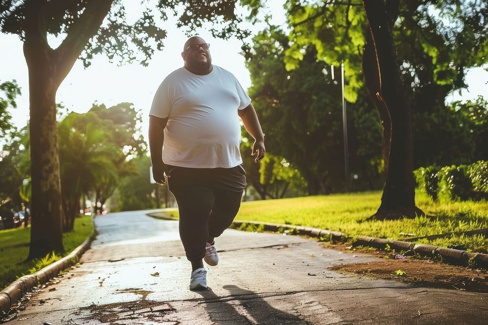 Plus size man running walking | Premium Photo - rawpixel