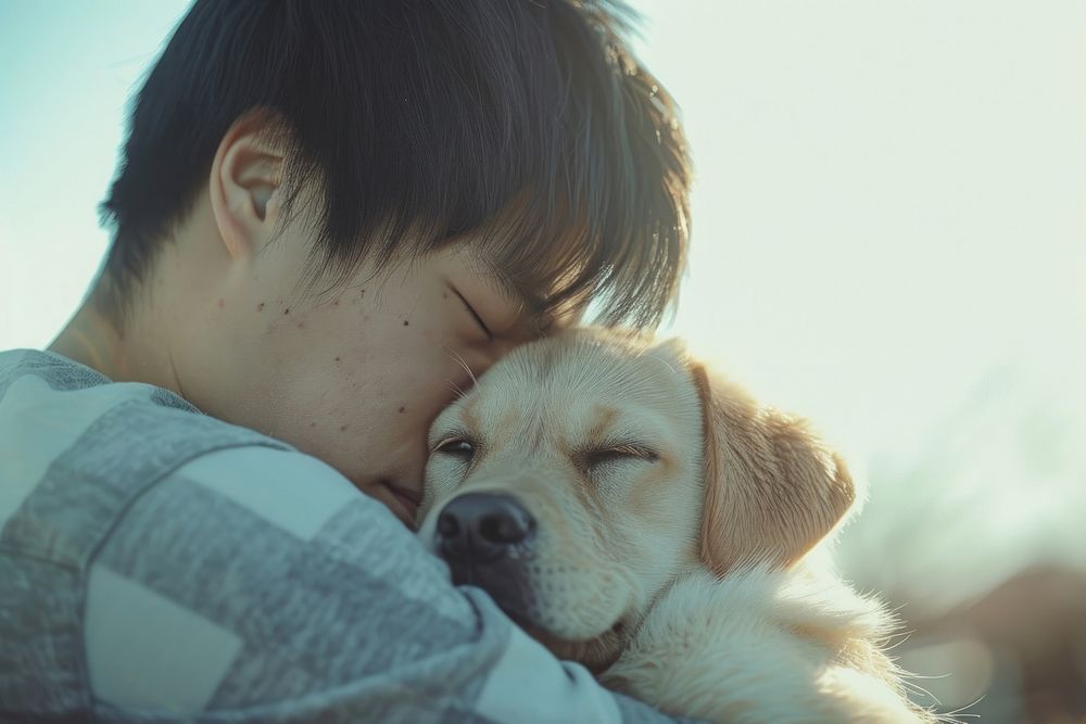 Asian man cuddling dog photography | Free Photo - rawpixel