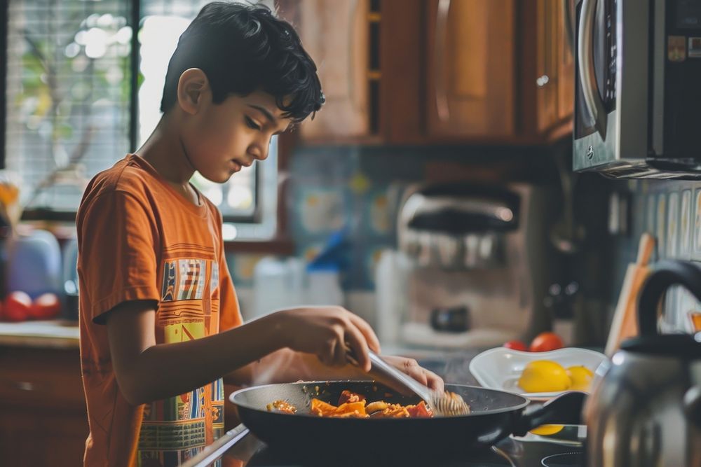 South Asian boy cooking food | Free Photo - rawpixel