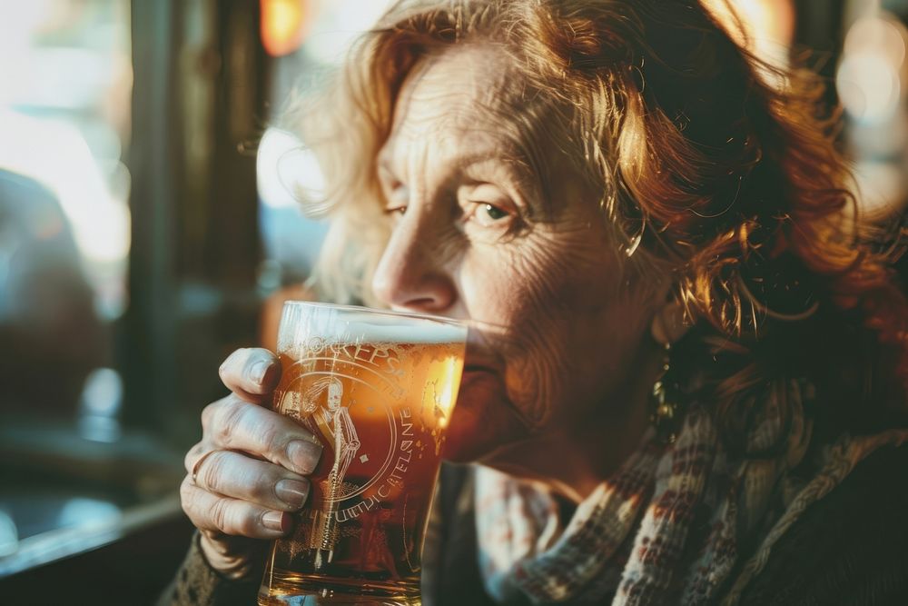 Mature woman drinking beer beverage. | Free Photo - rawpixel