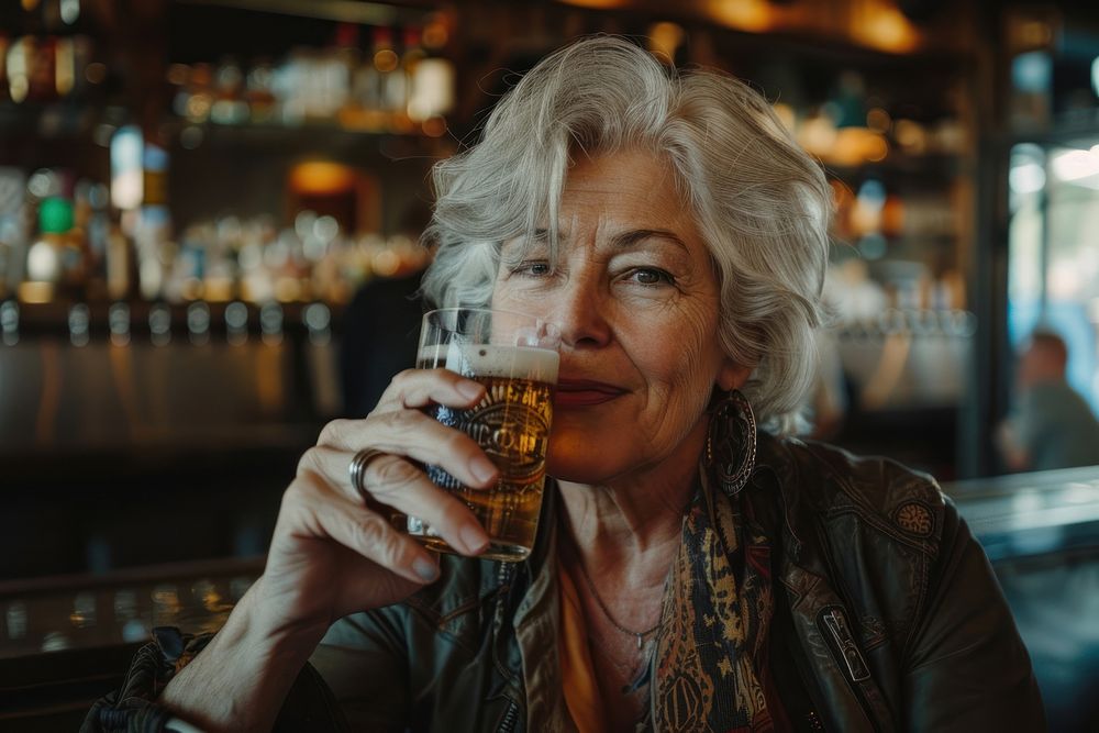 Mature woman drinking beer beverage. | Premium Photo - rawpixel