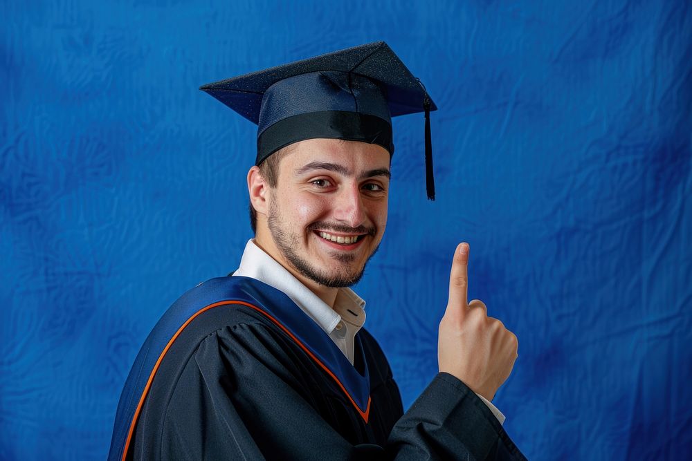 Smiley man point finger graduation | Free Photo - rawpixel
