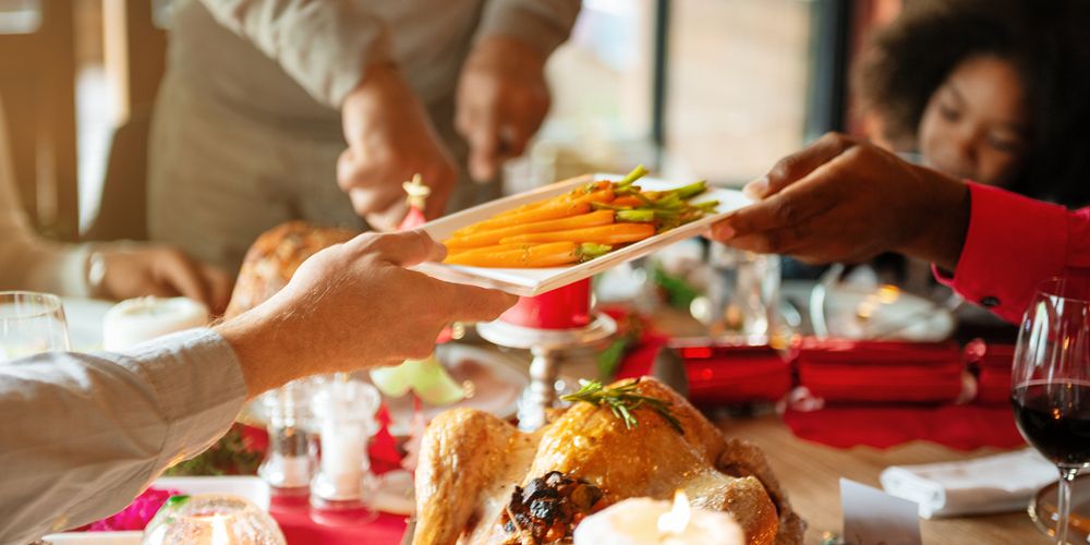 Festive dinner group sharing food. | Premium Photo - rawpixel