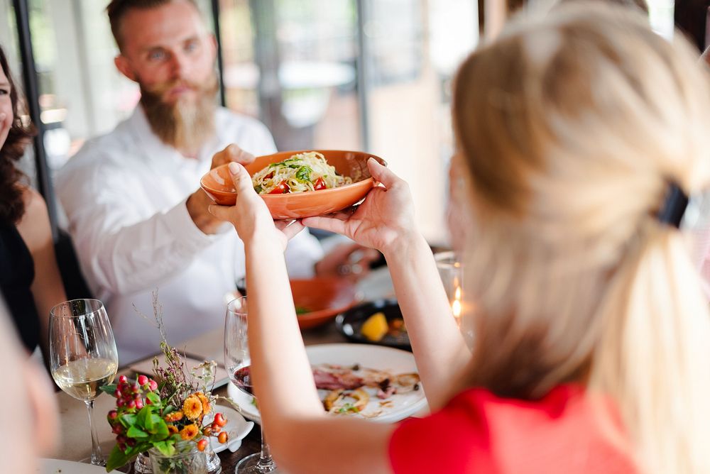 group dining, sharing pasta. man | Premium Photo - rawpixel