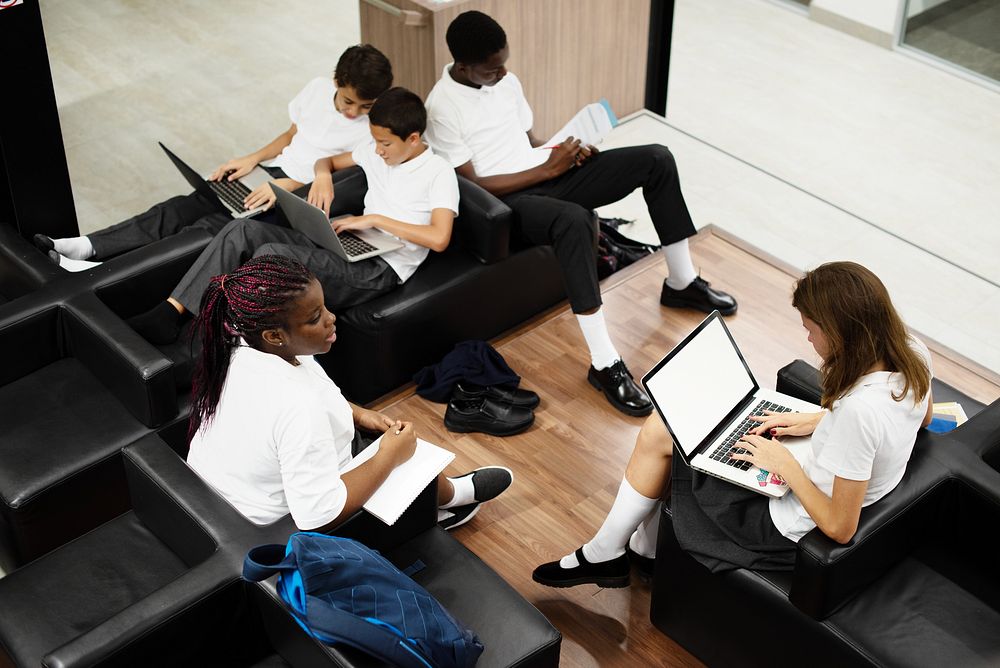 Students uniforms studying laptops lounge. | Premium Photo - rawpixel
