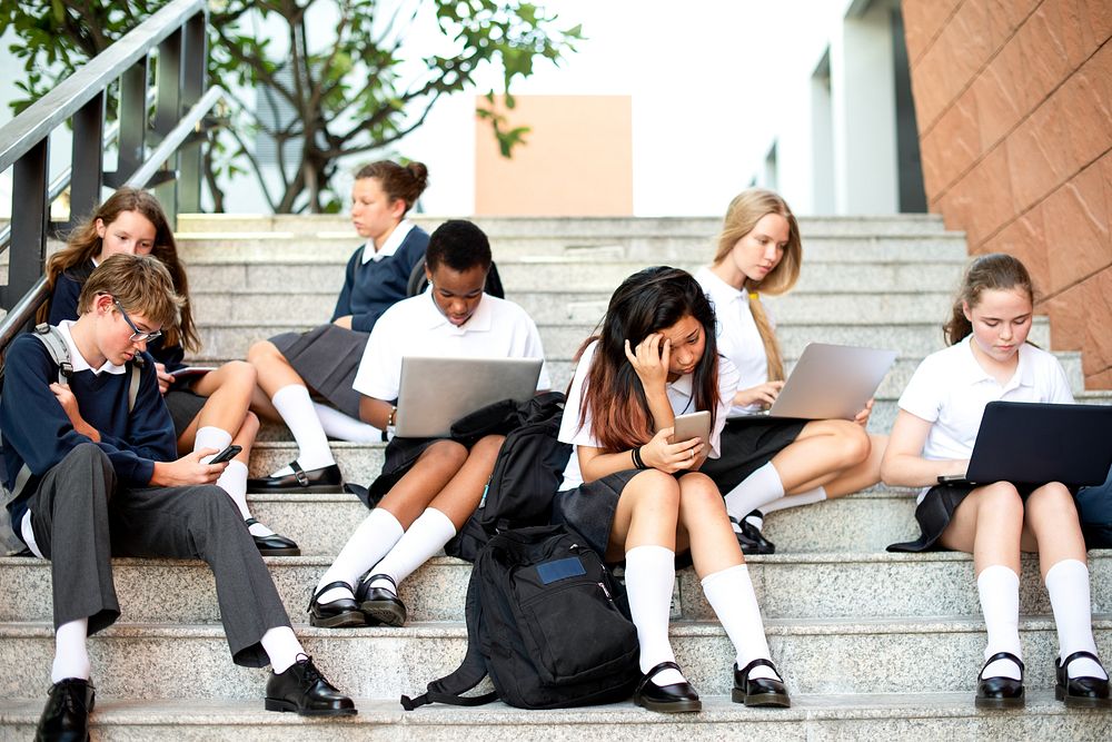 Group students uniforms sitting stairs, | Free Photo - rawpixel