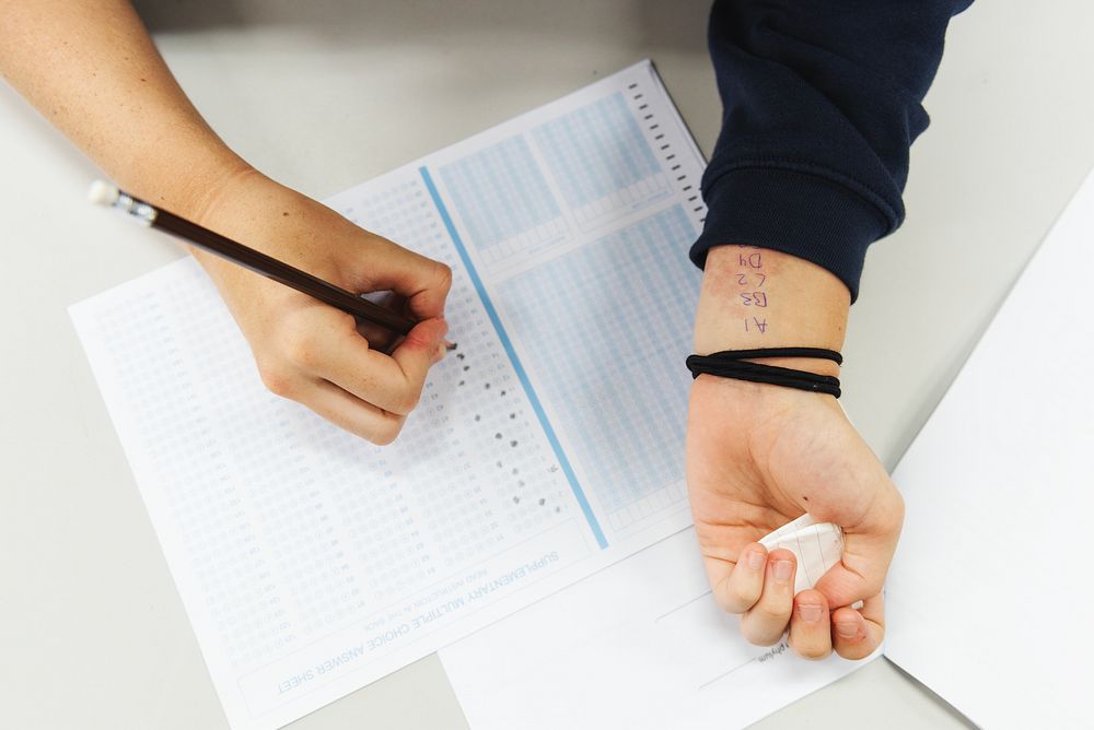 Person taking test, filling answers | Premium Photo - rawpixel