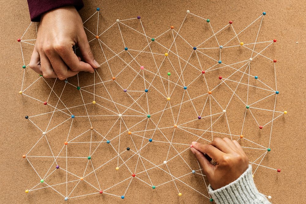 Hands connecting strings corkboard, creating | Free Photo - rawpixel