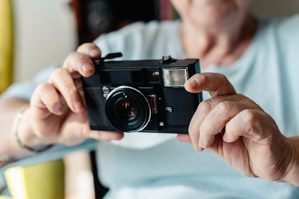 Close-up hands holding vintage camera. | Free Photo - rawpixel