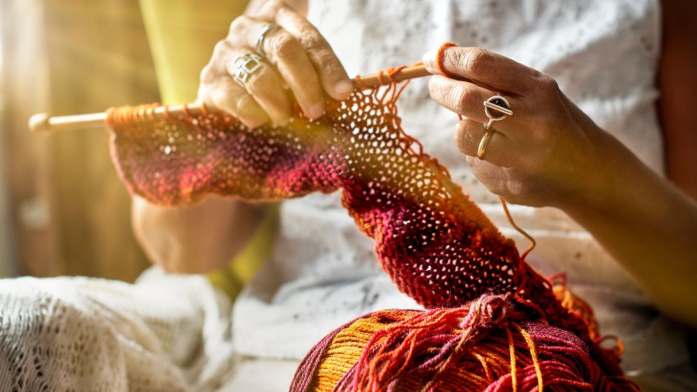 Close-up hands knitting red yarn. | Premium Photo - rawpixel