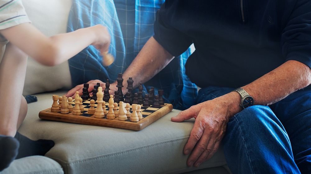 Two people playing chess couch. | Premium Photo - rawpixel