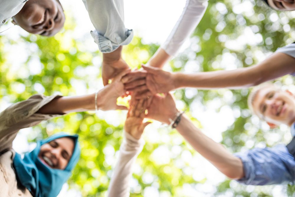 Diverse group people joining hands | Premium Photo - rawpixel
