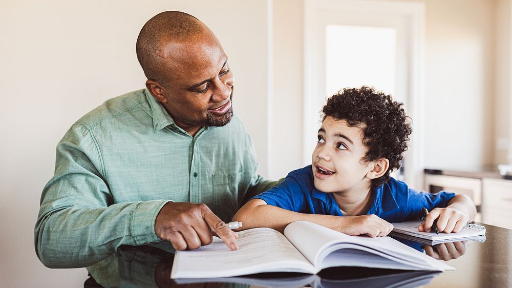 African American man teaching his | Free Photo - rawpixel