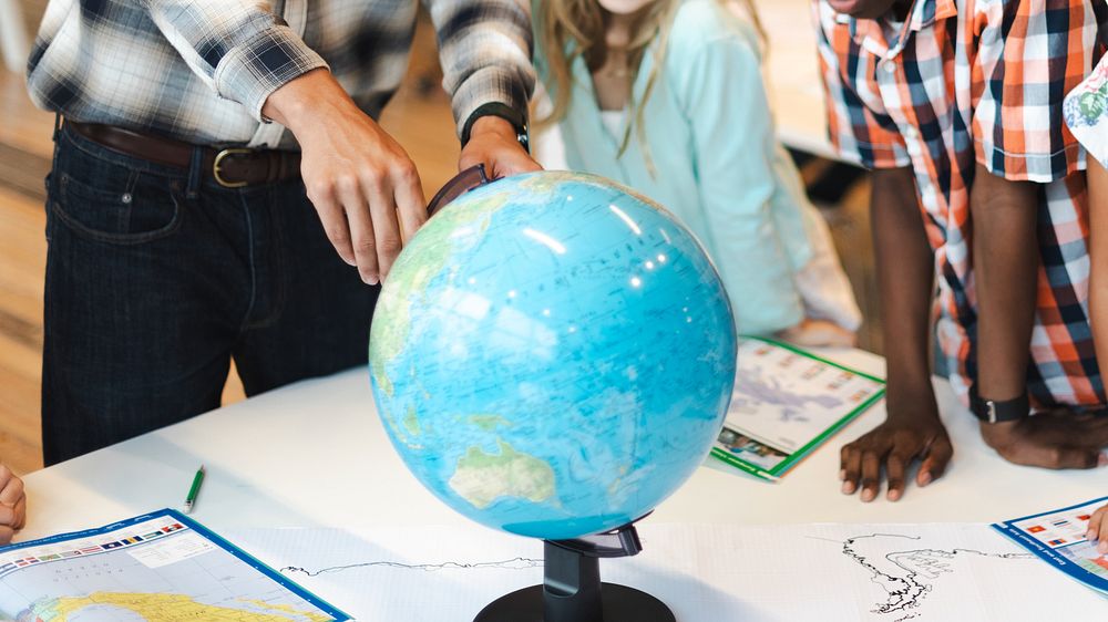Diverse group children exploring globe. | Free Photo - rawpixel