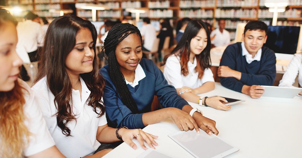 Diverse students studying together library, | Free Photo - rawpixel