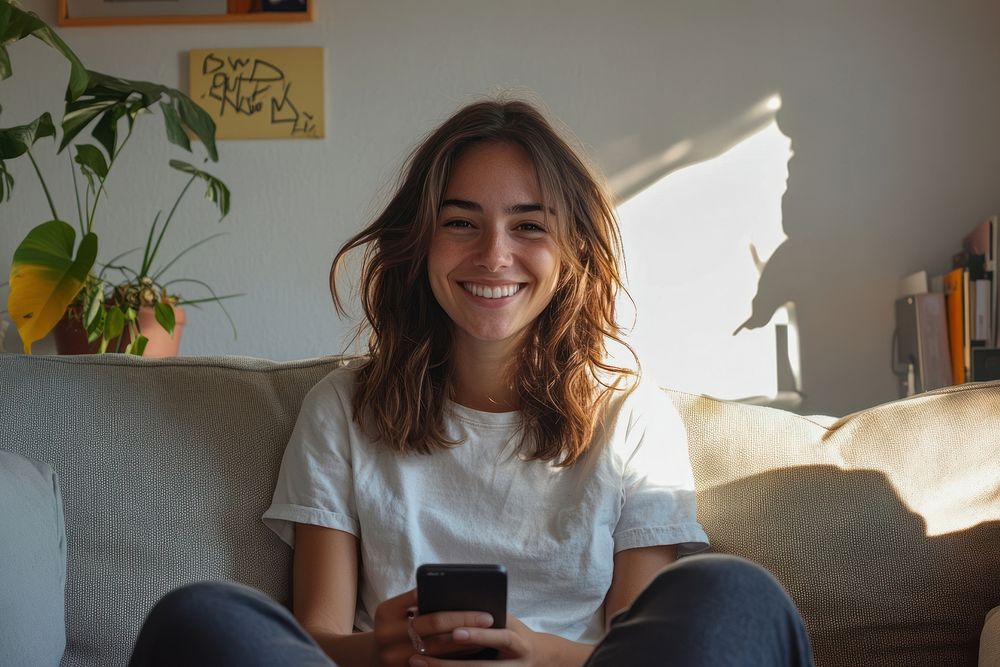 Smiling woman phone happy light. | Free Photo - rawpixel