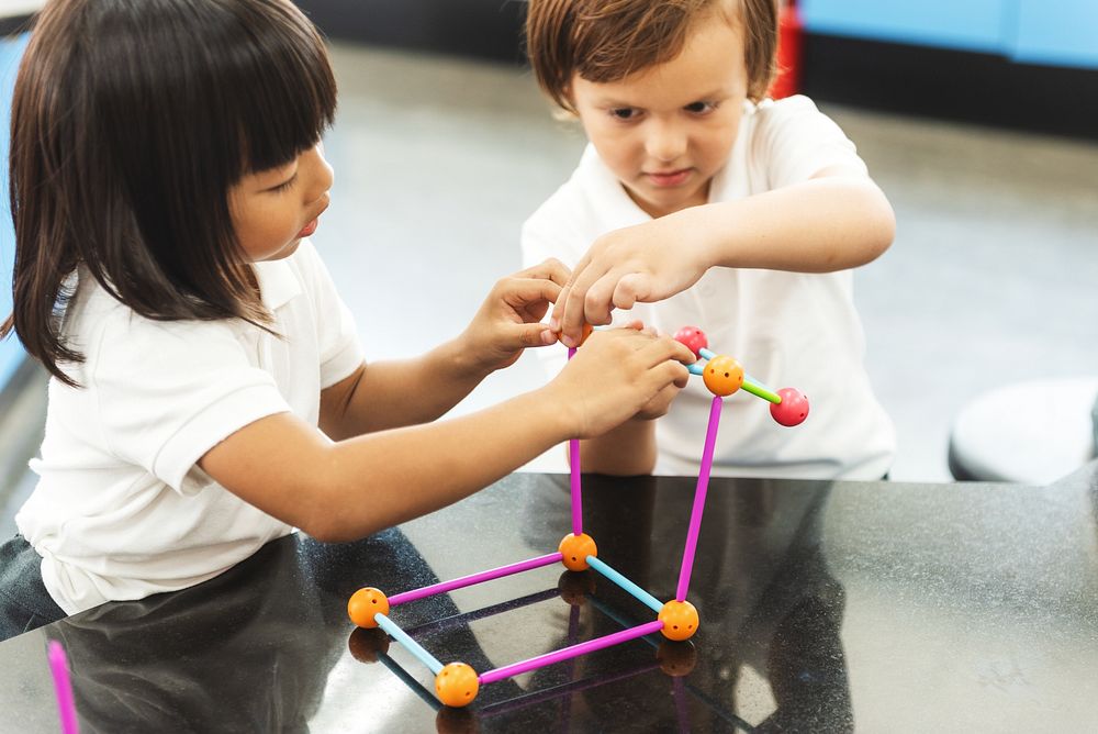 Two children building 3D structure | Free Photo - rawpixel