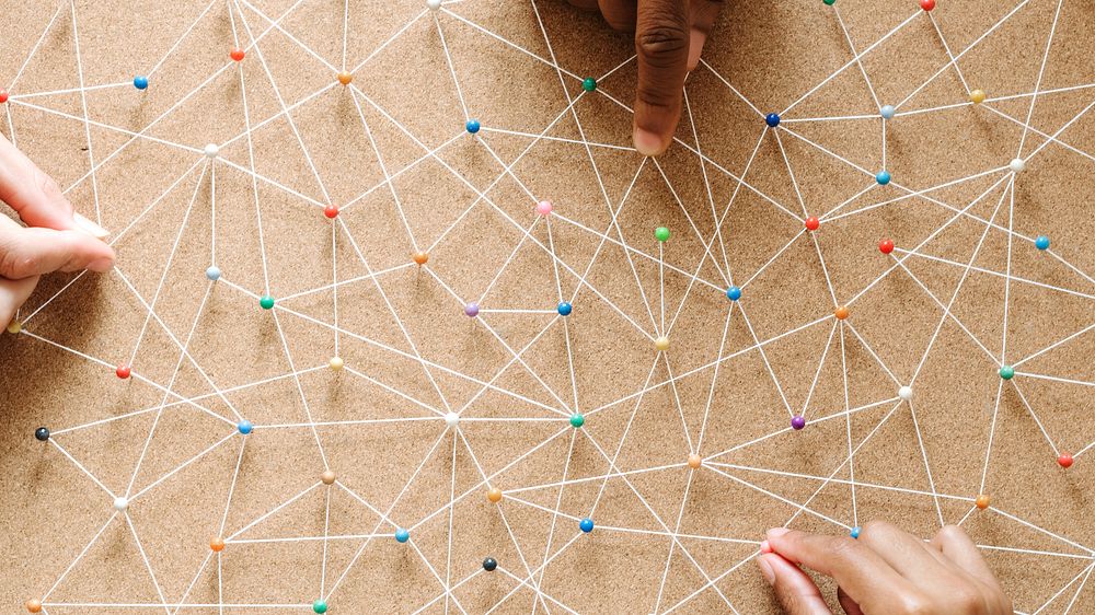 Hands connecting string corkboard, creating | Free Photo - rawpixel
