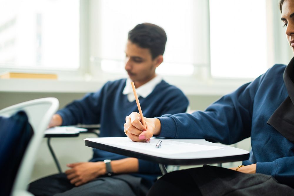 Students classroom, focused writing. Classroom | Free Photo - rawpixel